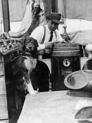 Ernest Shackleton with dog on board ship – RGS Print Store